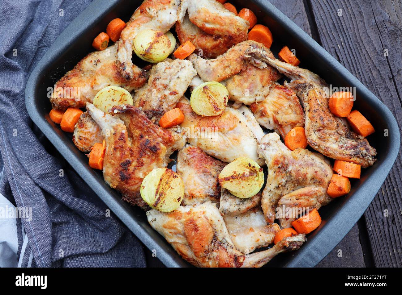 Roasted Rabbit Haunches in Pan with Stewed Vegetables on Rustic Wooden ...