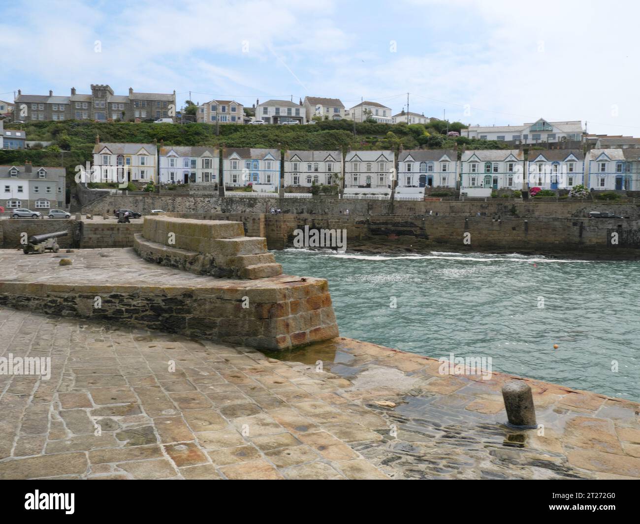Typical english row house with bay windows above the harbour of ...