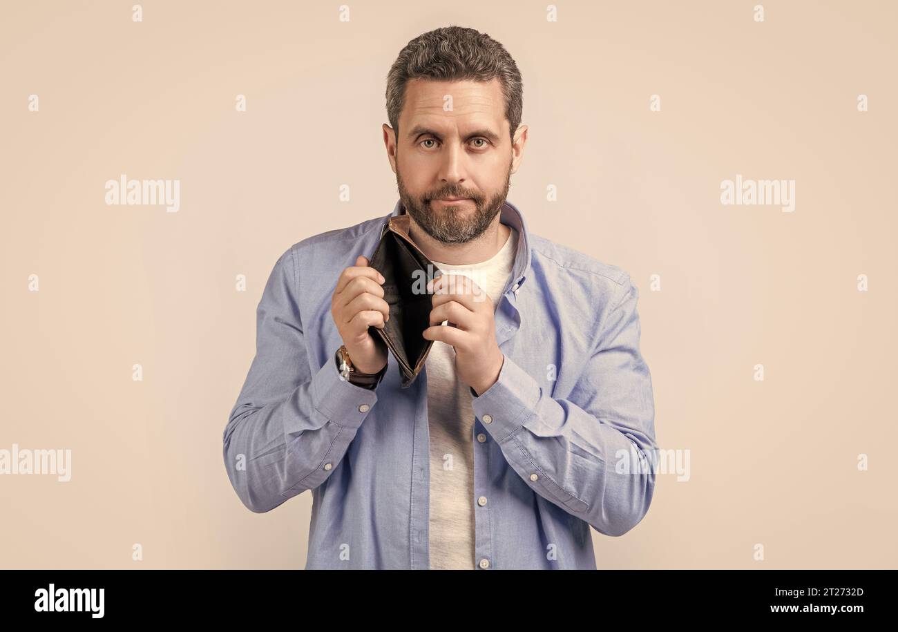 moneyless guy with empty wallet in studio. moneyless guy with wallet at ...