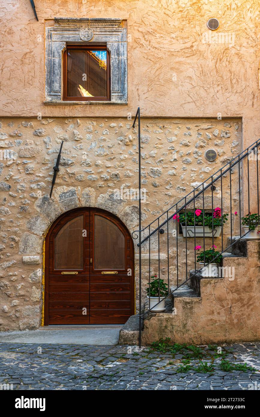 Glimpses of the medieval village with covered steps and stone houses of ...