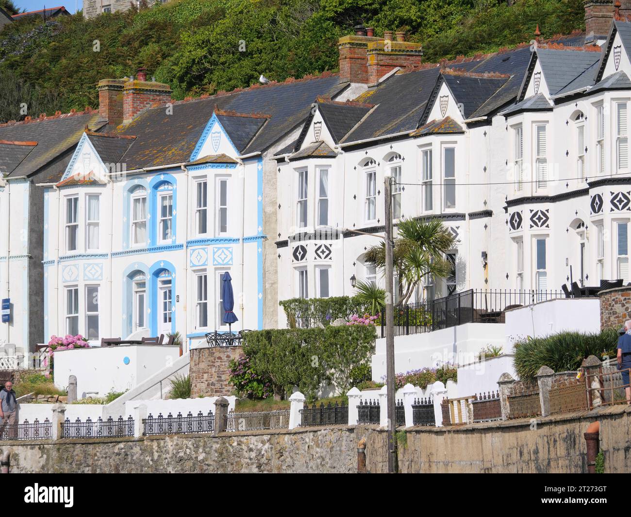 Typical english terraced houses with bay windows above the harbour of ...