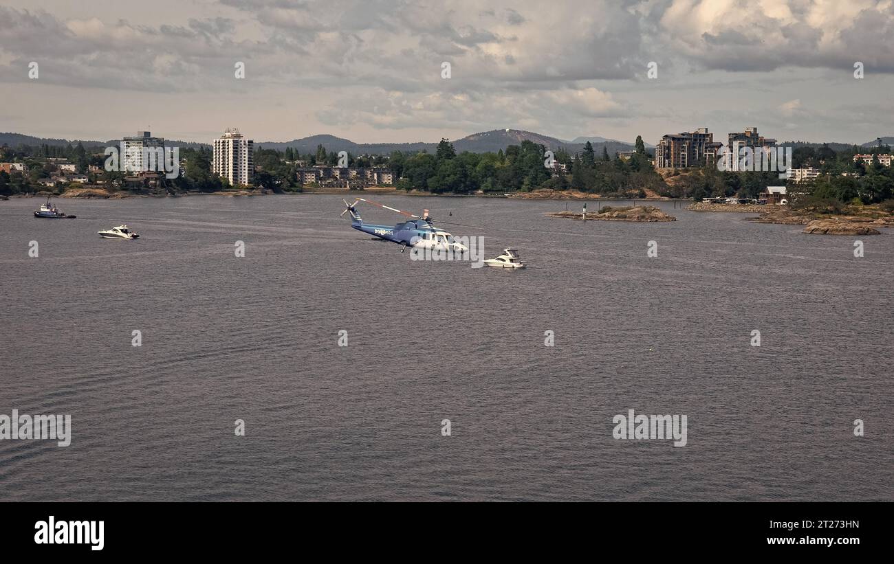 Victoria, Canada - June 28, 2019: helicopter flying over ocean sea ...