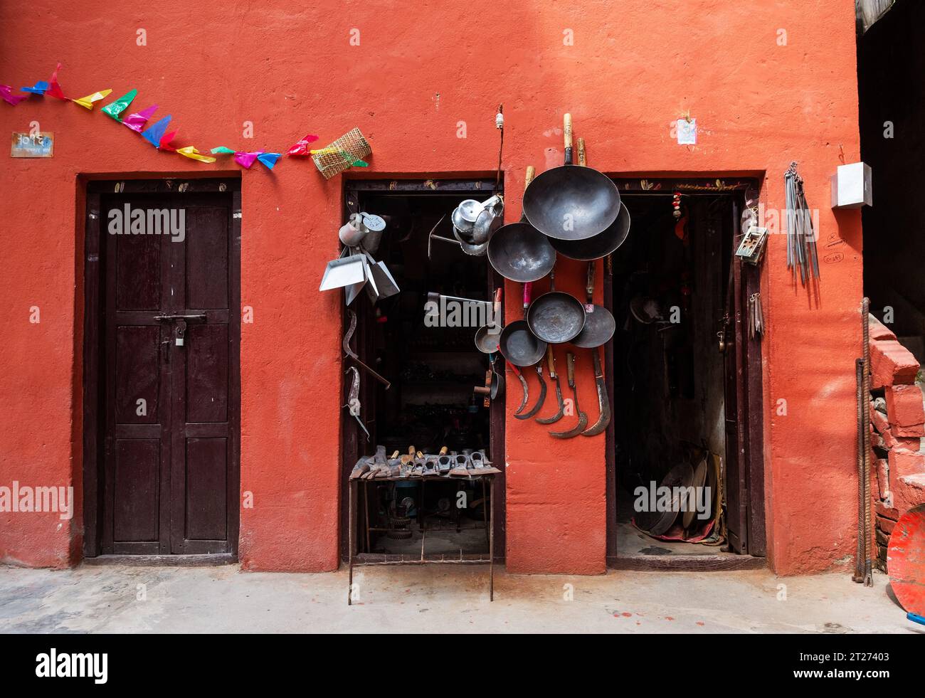 Hardware store with metal goods - pans, sickles, hoes, tools, tableware ...