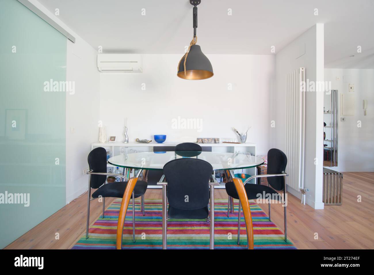 Contemporary dining space in a modern house. Glass table Stock Photo ...