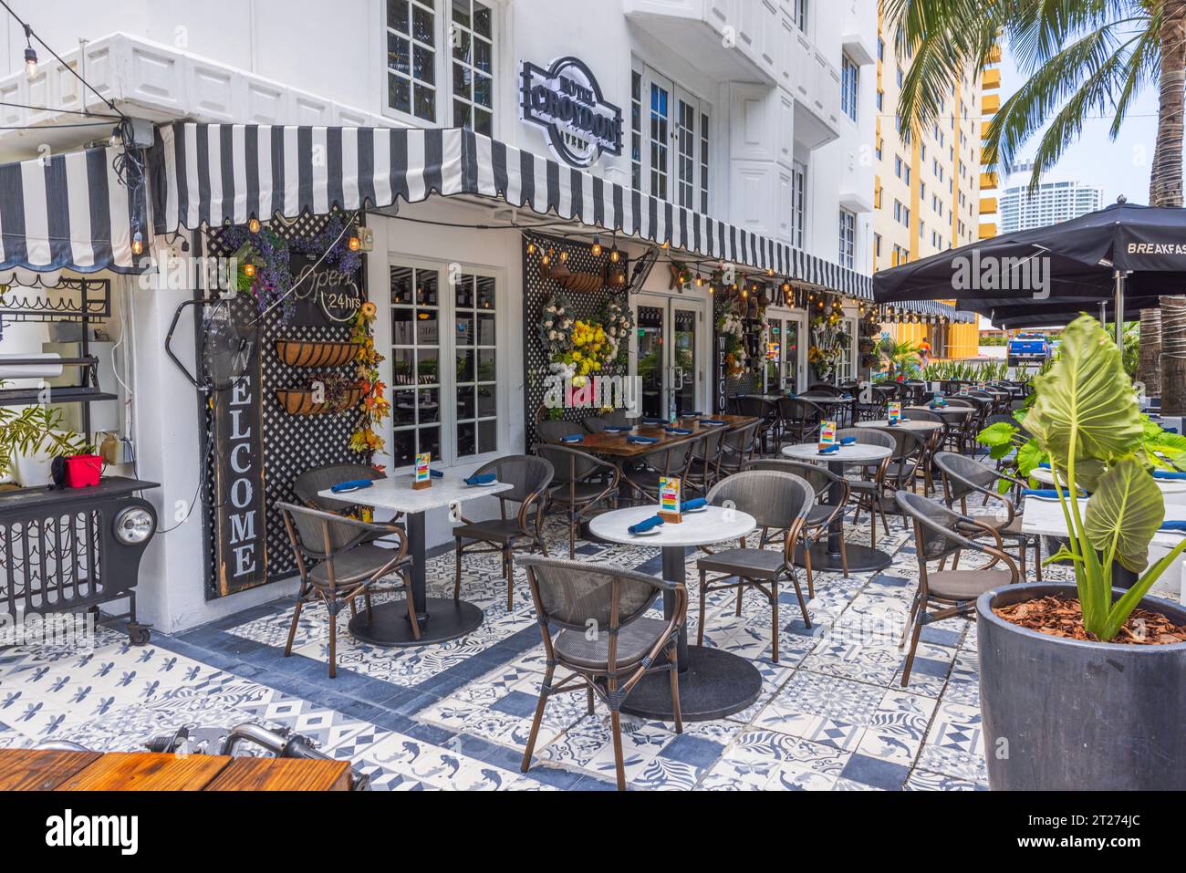 View of beautiful exterior of urban restaurant with prepared tables for ...