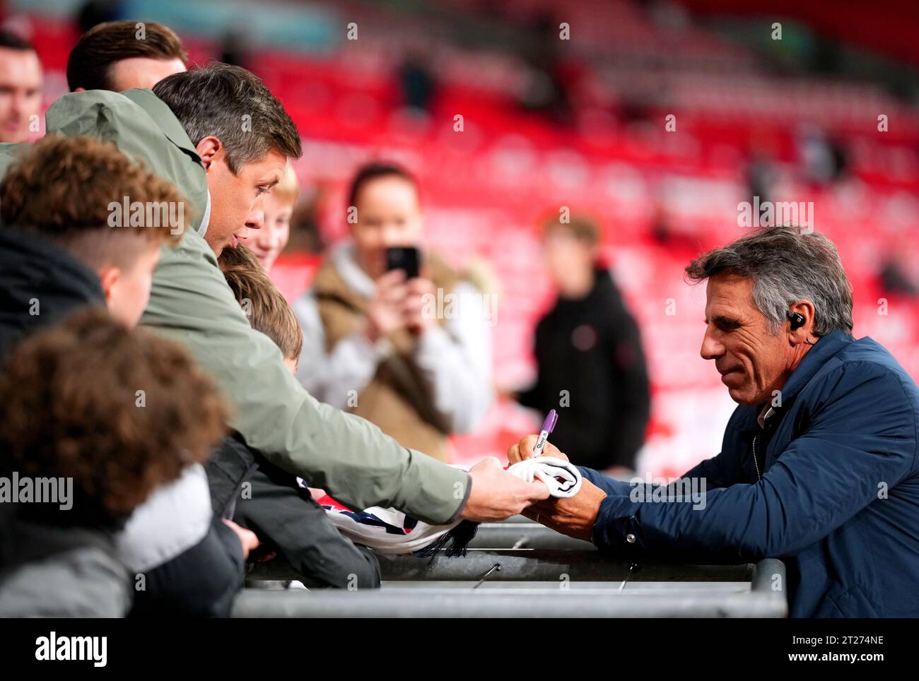 Gianfranco Zola signs an autograph for a fan ahead of the UEFA Euro ...