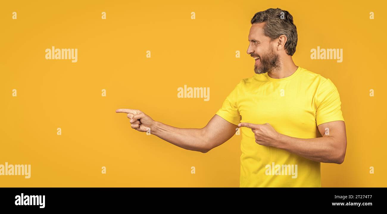 photo of happy man pointing at advertisement offer. man pointing at ...