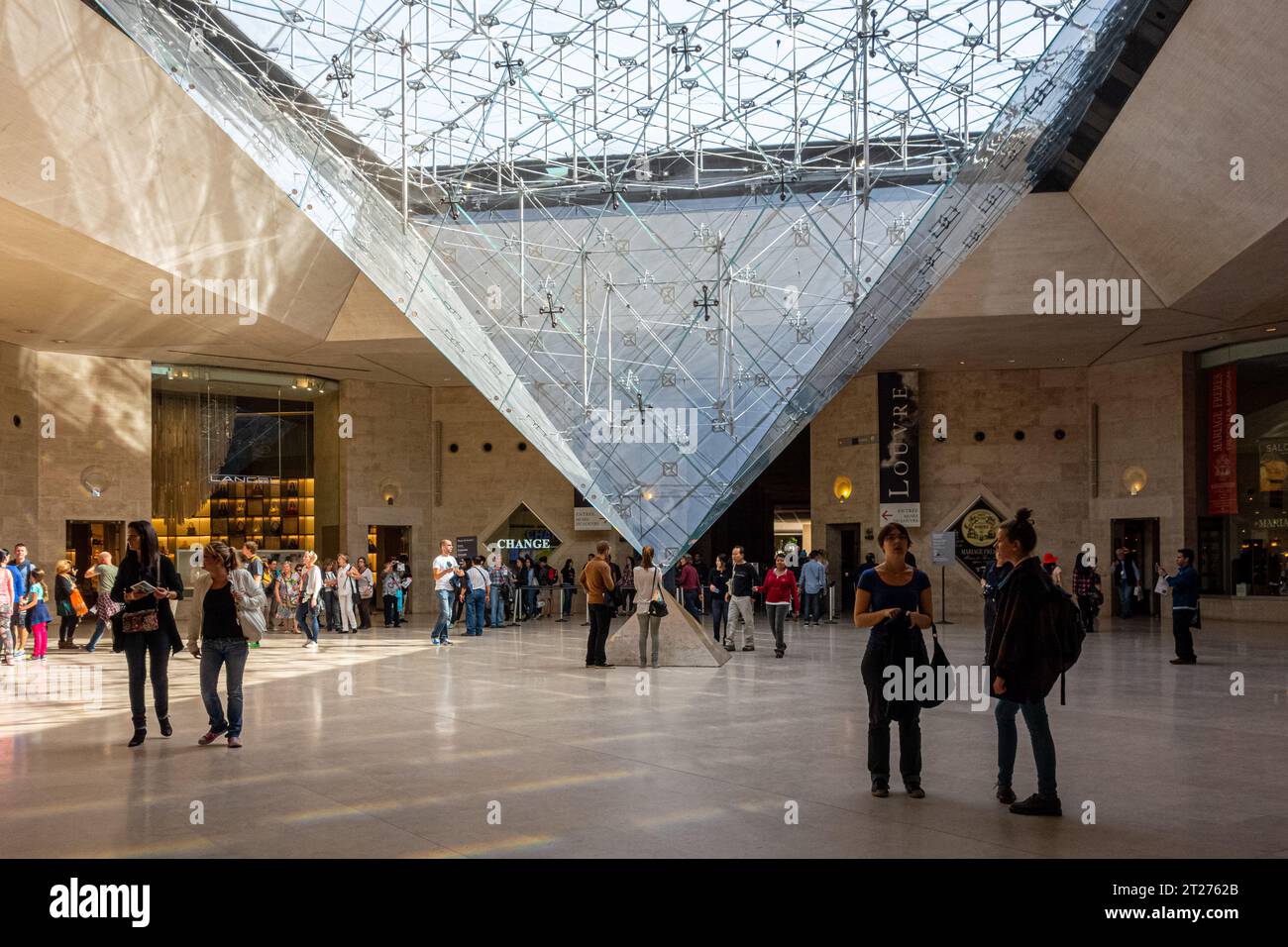 Crowd inside Louvre museum, near the inverted glass pyramid Stock Photo ...