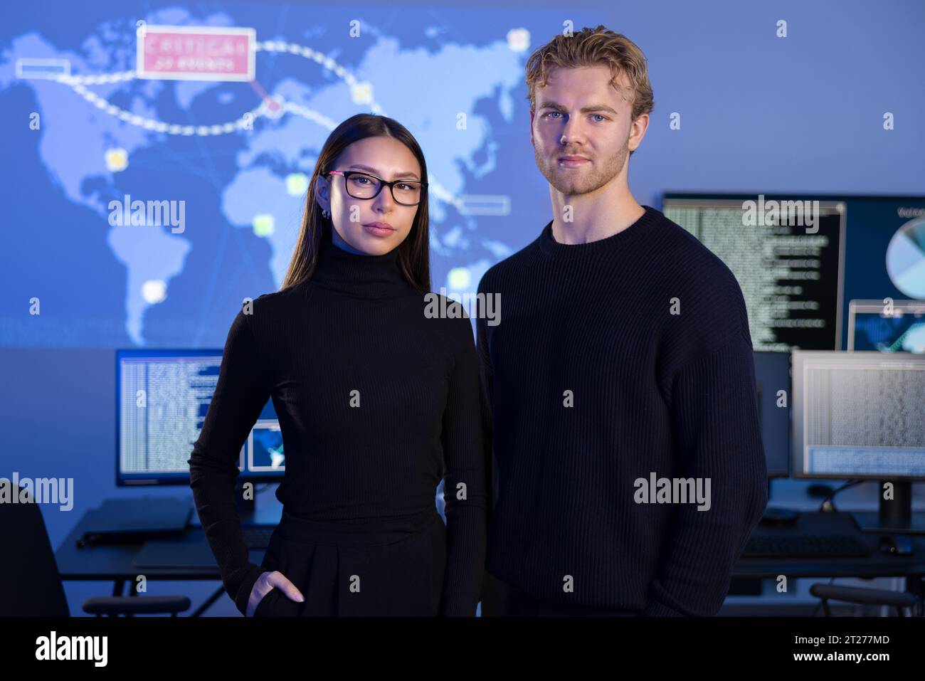 Professional and confident cyber security team in front of ...