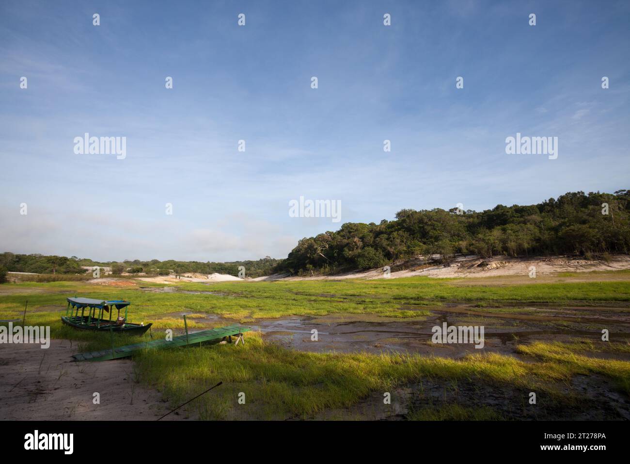 Boat stranded on dry river in extreme drought in the Amazon Rainforest ...