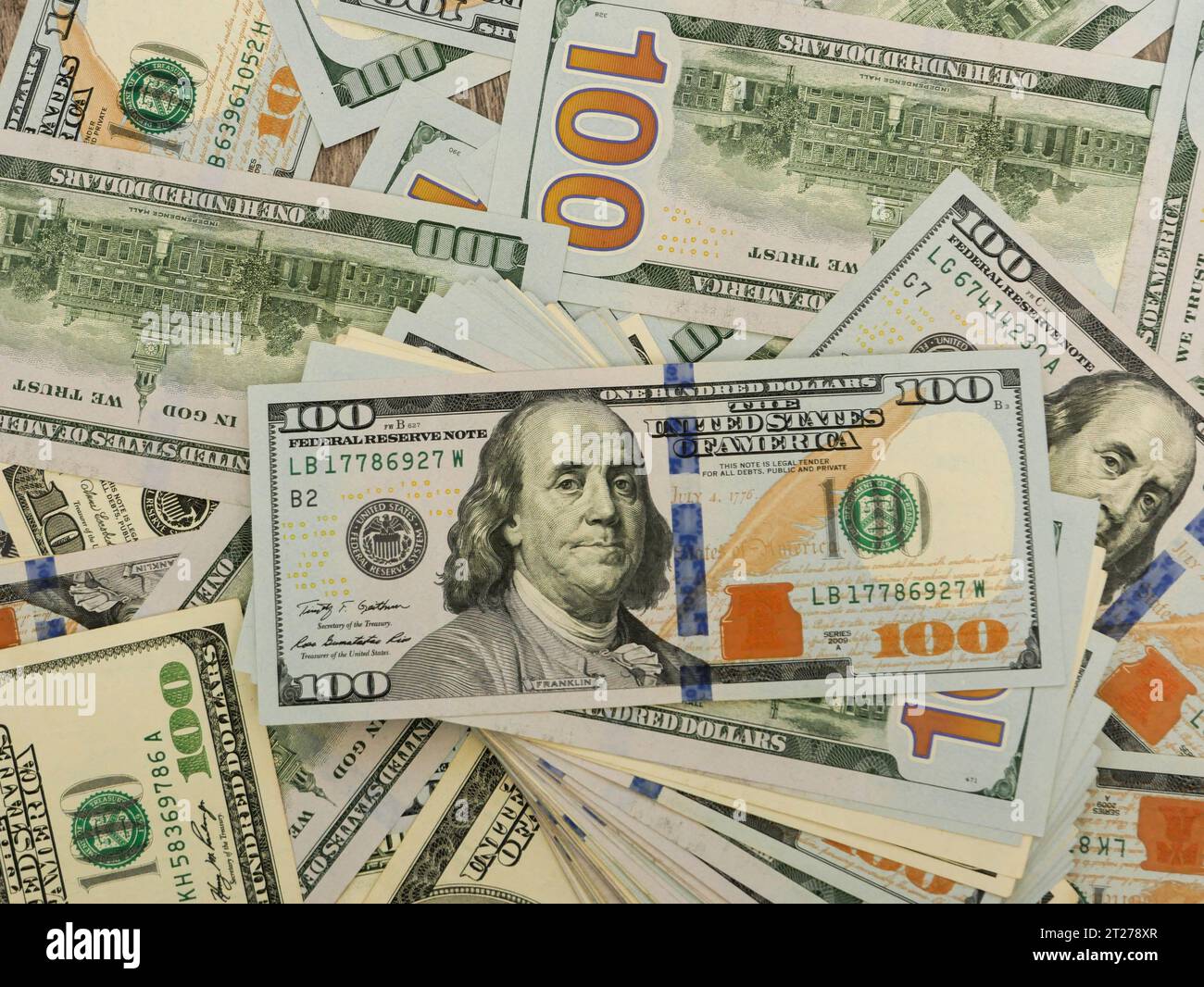 Group of money stack of 100 US dollars banknotes a lot of the ...