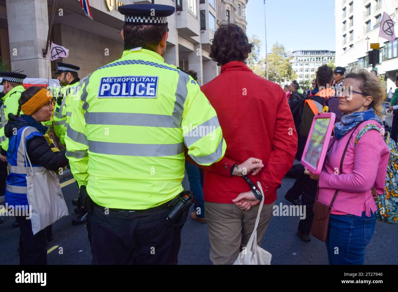 London, UK. 17th October 2023. Police officers arrest a climate ...