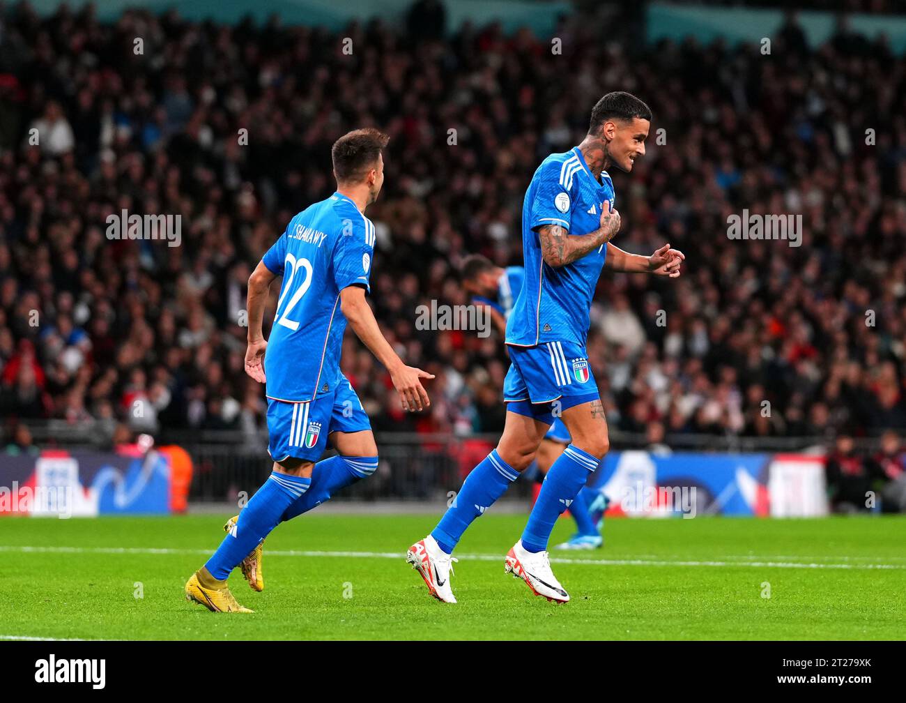 Italy's Gianluca Scamacca (right) celebrates scoring their side's first ...