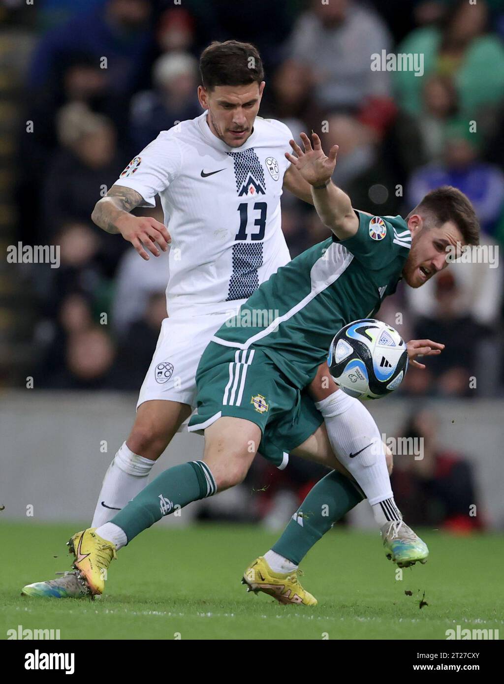 Northern Ireland's Paul Smyth battles with Slovenia’s Erik Janza during ...