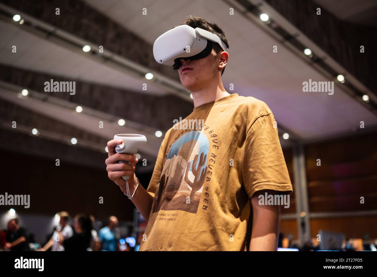 Teenager playing with Meta Quest 2 all-in-one VR headset during ZGamer ...