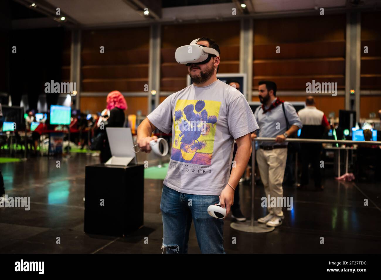 Young man playing with Meta Quest 2 all-in-one VR headset during ZGamer ...