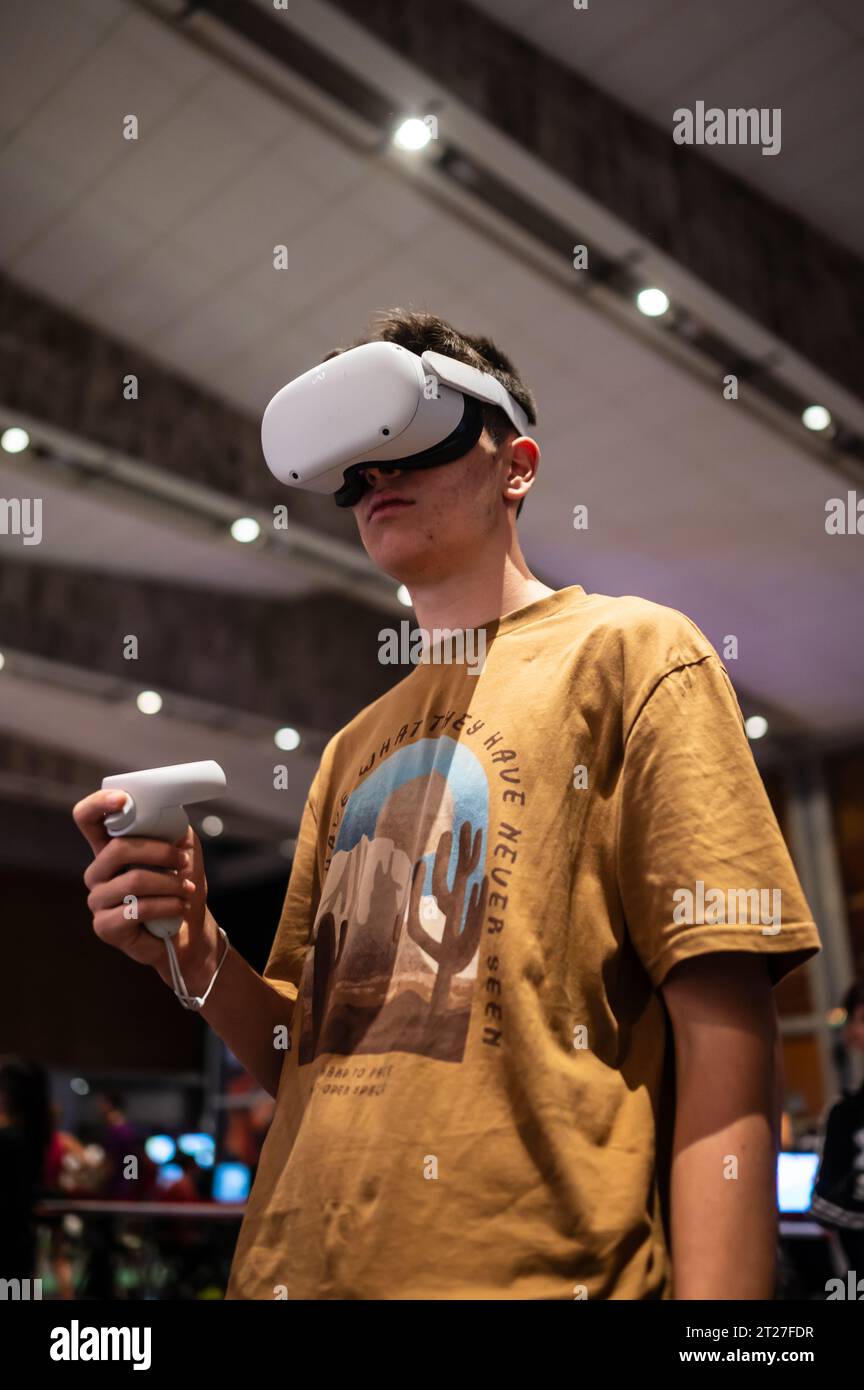 Teenager playing with Meta Quest 2 all-in-one VR headset during ZGamer ...
