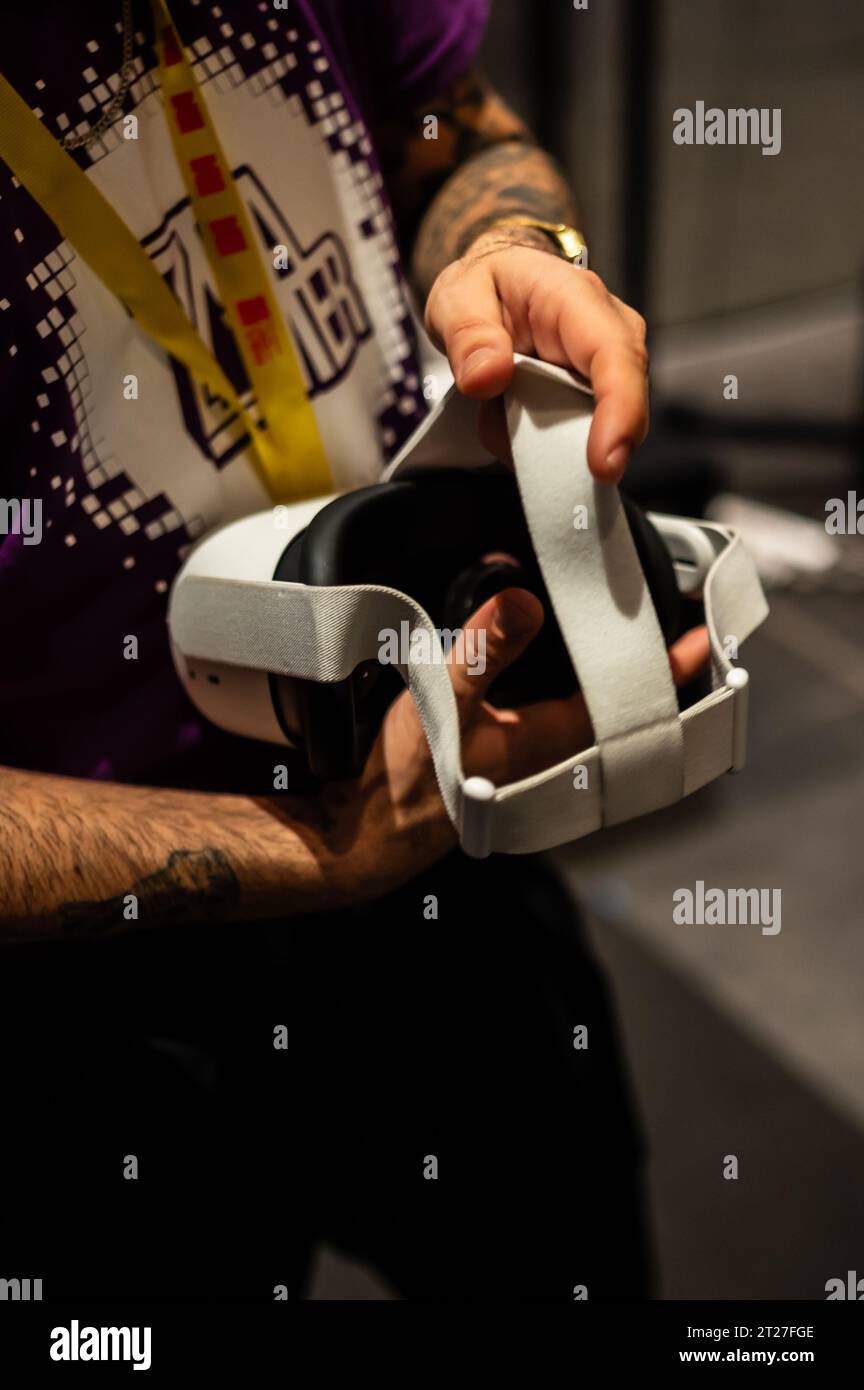 Young man playing with Meta Quest 2 all-in-one VR headset during ZGamer ...