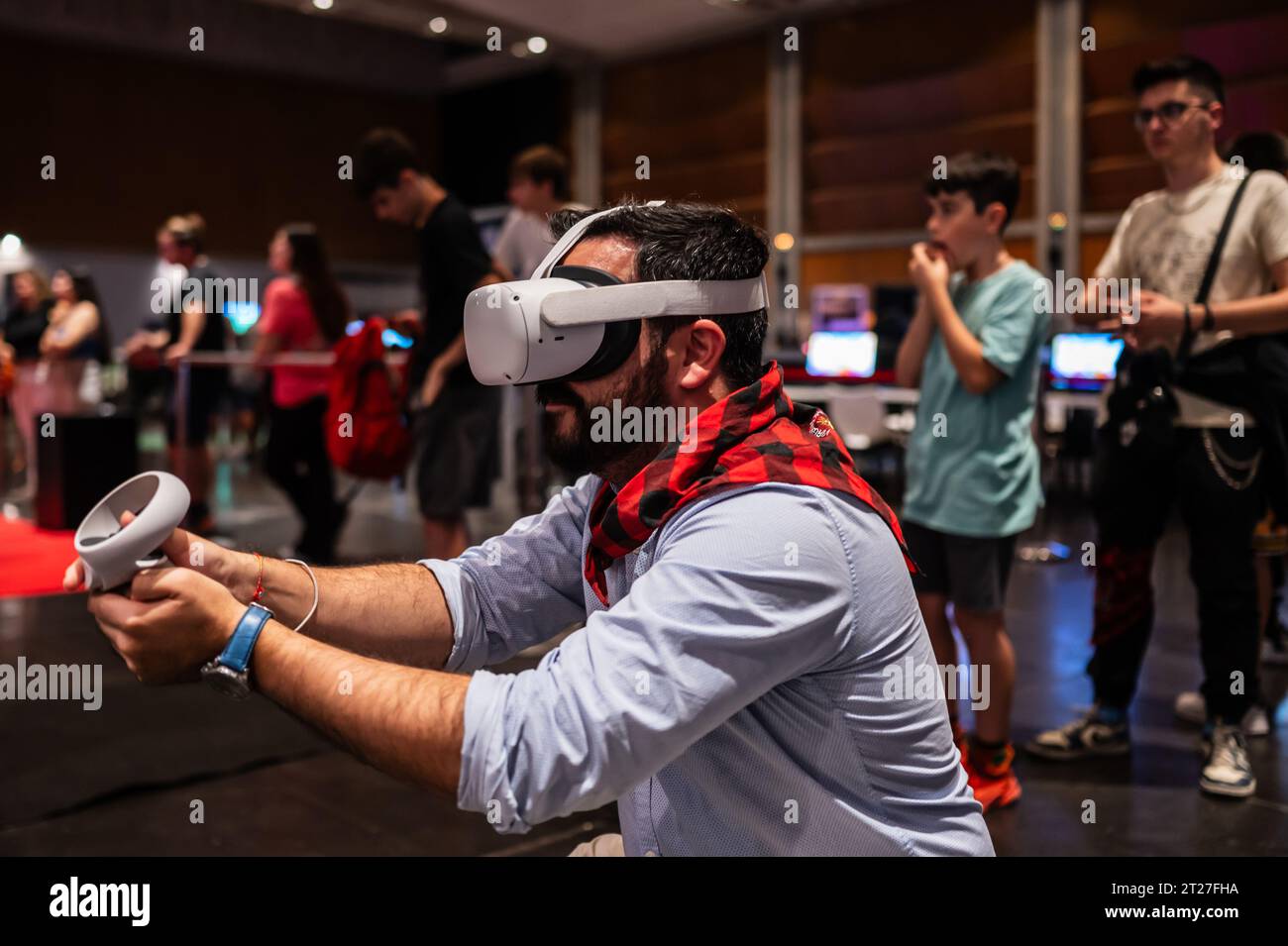 Young man playing with Meta Quest 2 all-in-one VR headset during ZGamer ...