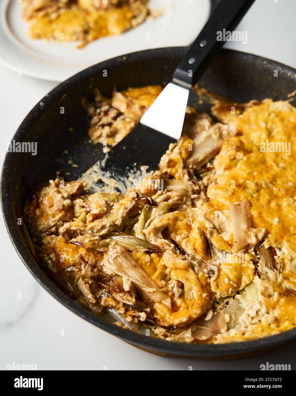 Cheesy Leeks. Leeks with cheese sauce and heavy cream Stock Photo - Alamy