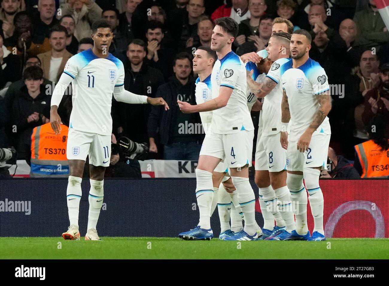 England's Marcus Rashford, left, celebrates after scoring his side's ...