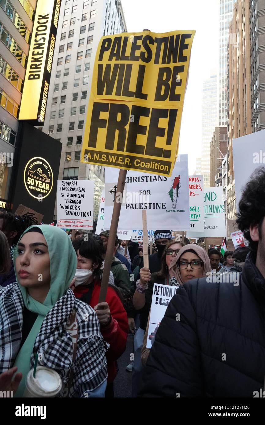 Pro-Palestinian protesters hold placards expressing their opinion ...