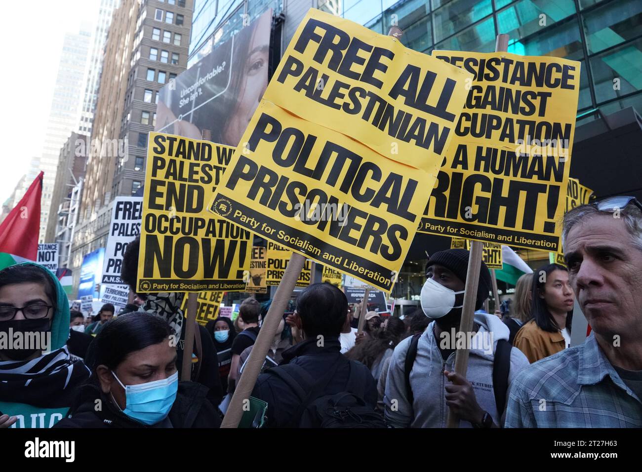 Pro-Palestinian protesters hold placards expressing their opinion ...