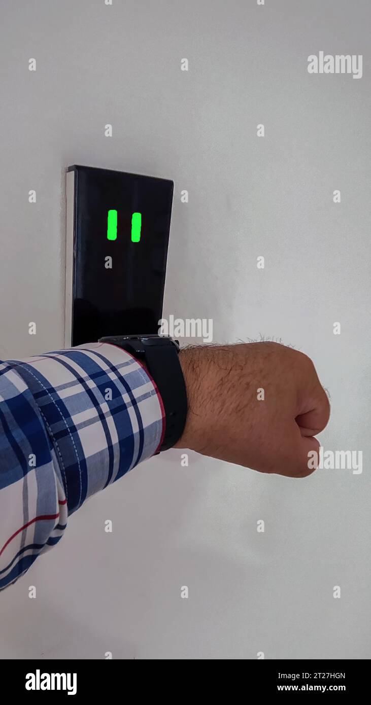 person using a smart watch with NFC technology to clock in and clock ...