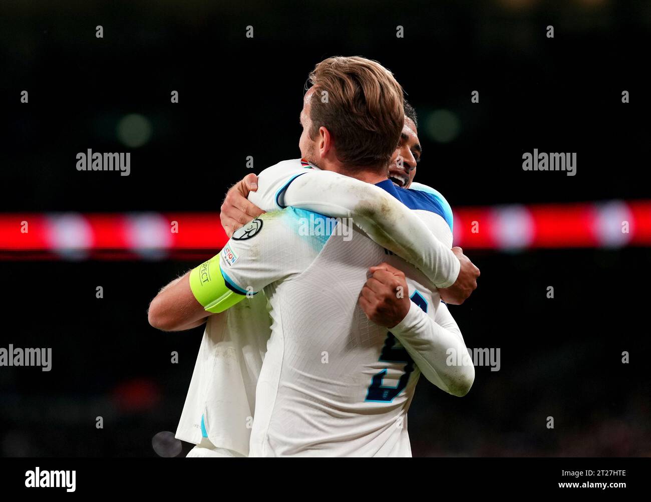 England's Harry Kane (right) celebrates with team-mate Jude Bellingham ...