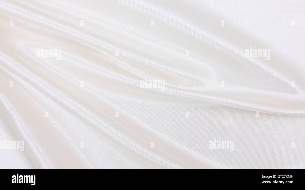 Smooth elegant white silk or satin luxury cloth texture can use as ...