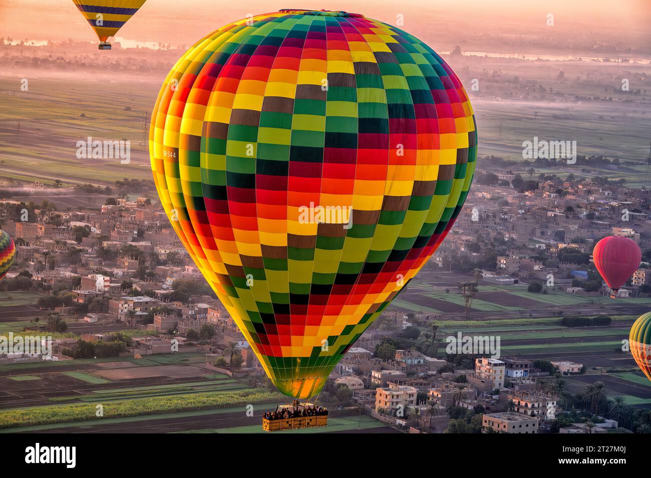 Hot Air Balloons in the west bank flying east over agricultural land towards the River Nile ...