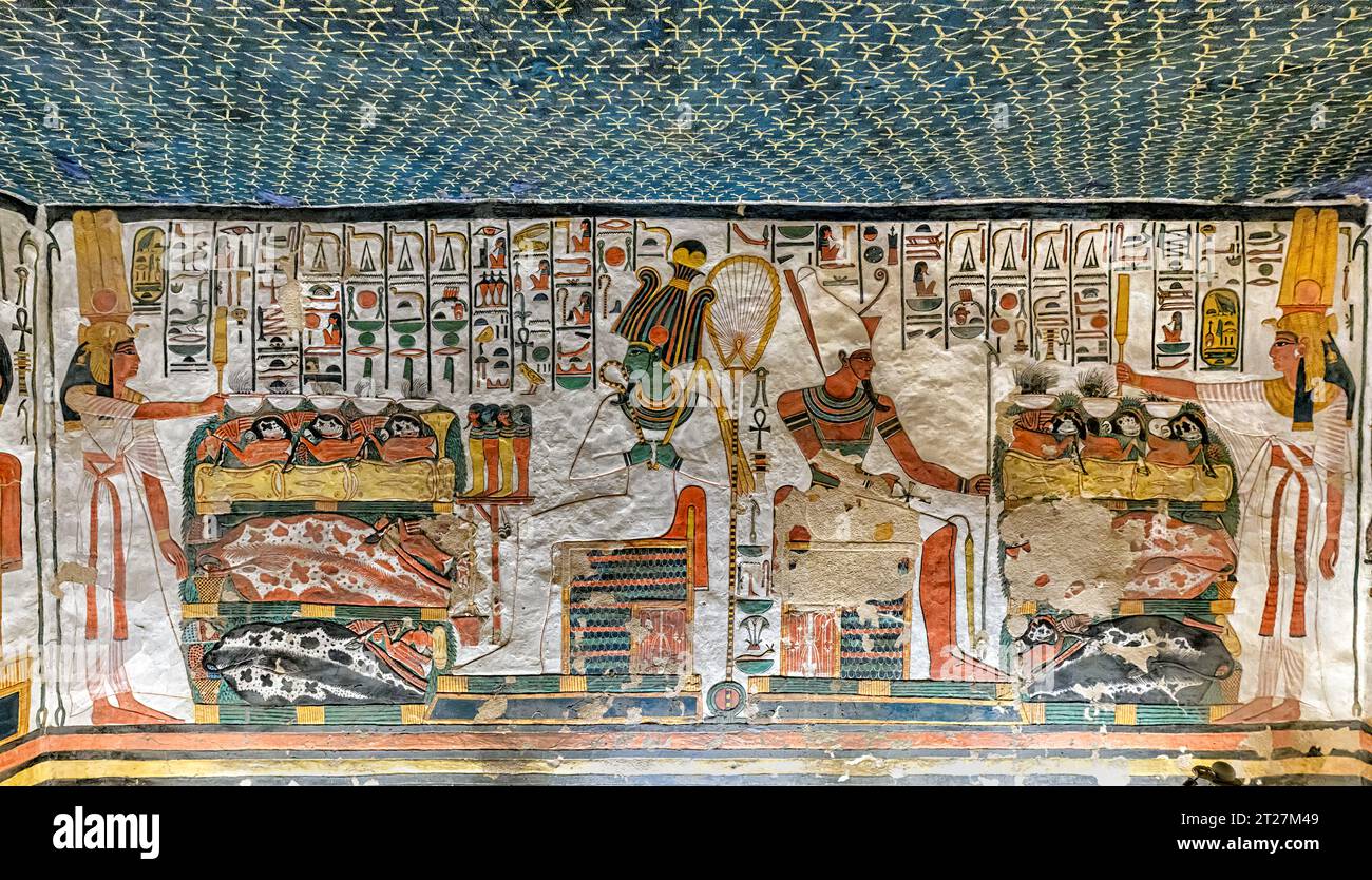 Nefertari stands offering huge piles of food to Atum on the RHS and ...