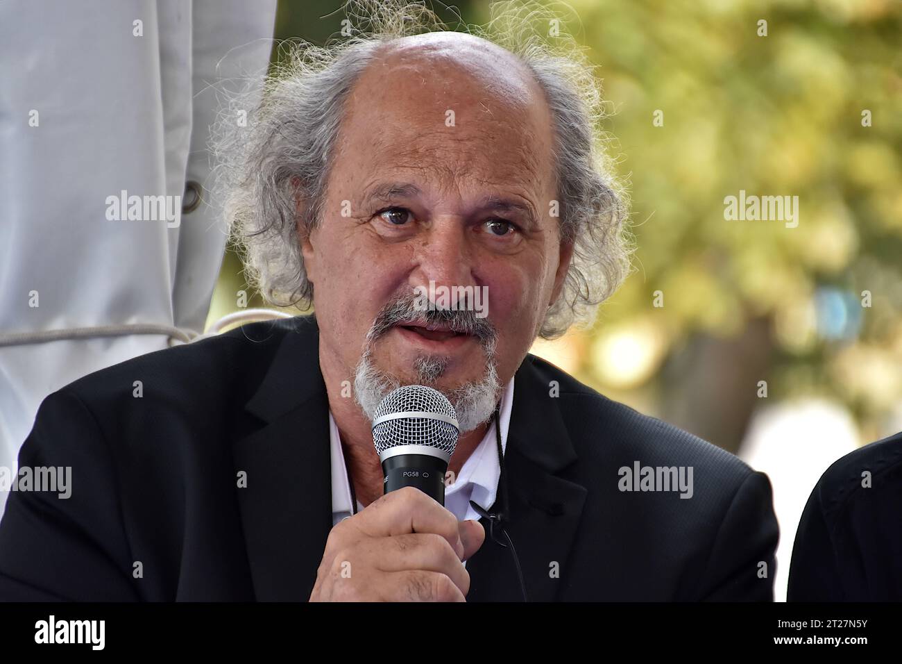 Richard Martin is seen speaking on the microphone in Marseille. Richard ...