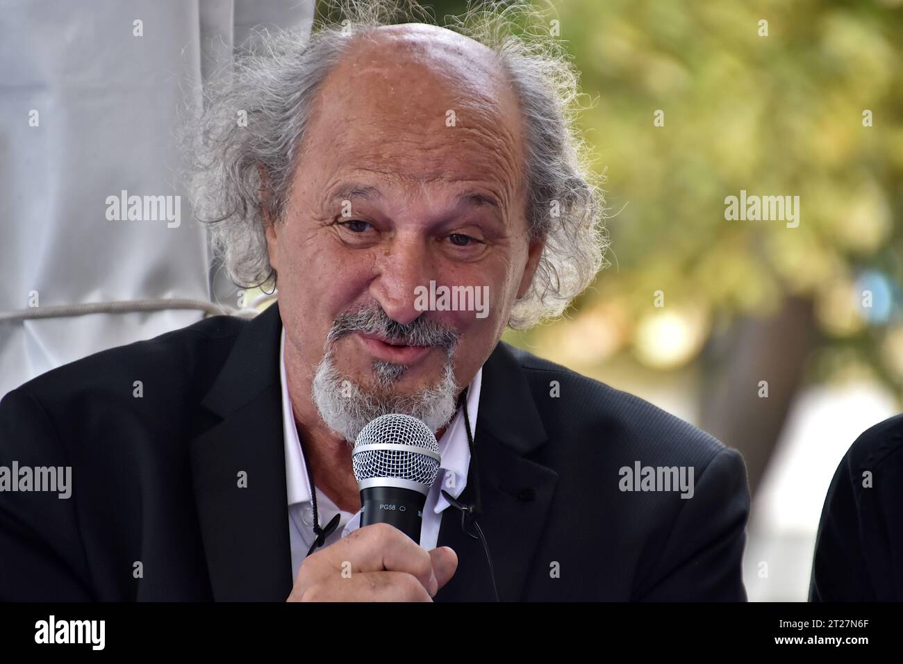 Richard Martin is seen speaking on the microphone in Marseille. Richard ...