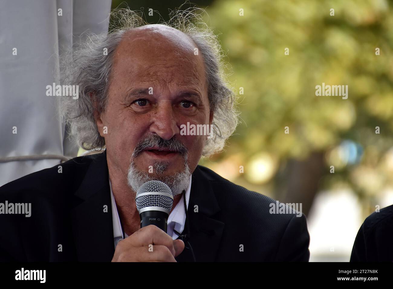 Richard Martin is seen speaking on the microphone in Marseille. Richard ...