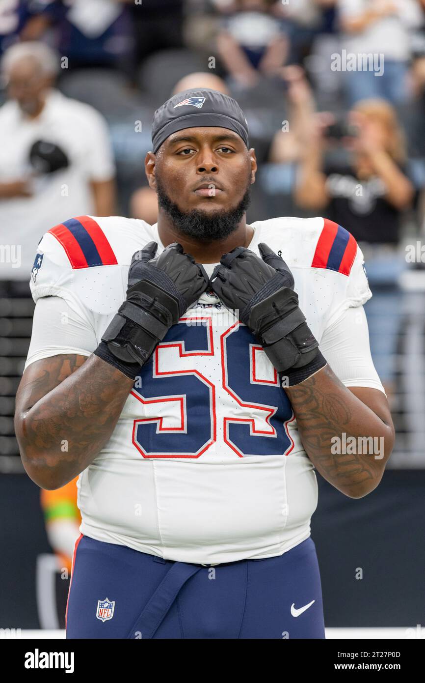 New England Patriots offensive lineman Vederian Lowe (59) stands for the National Anthem before ...