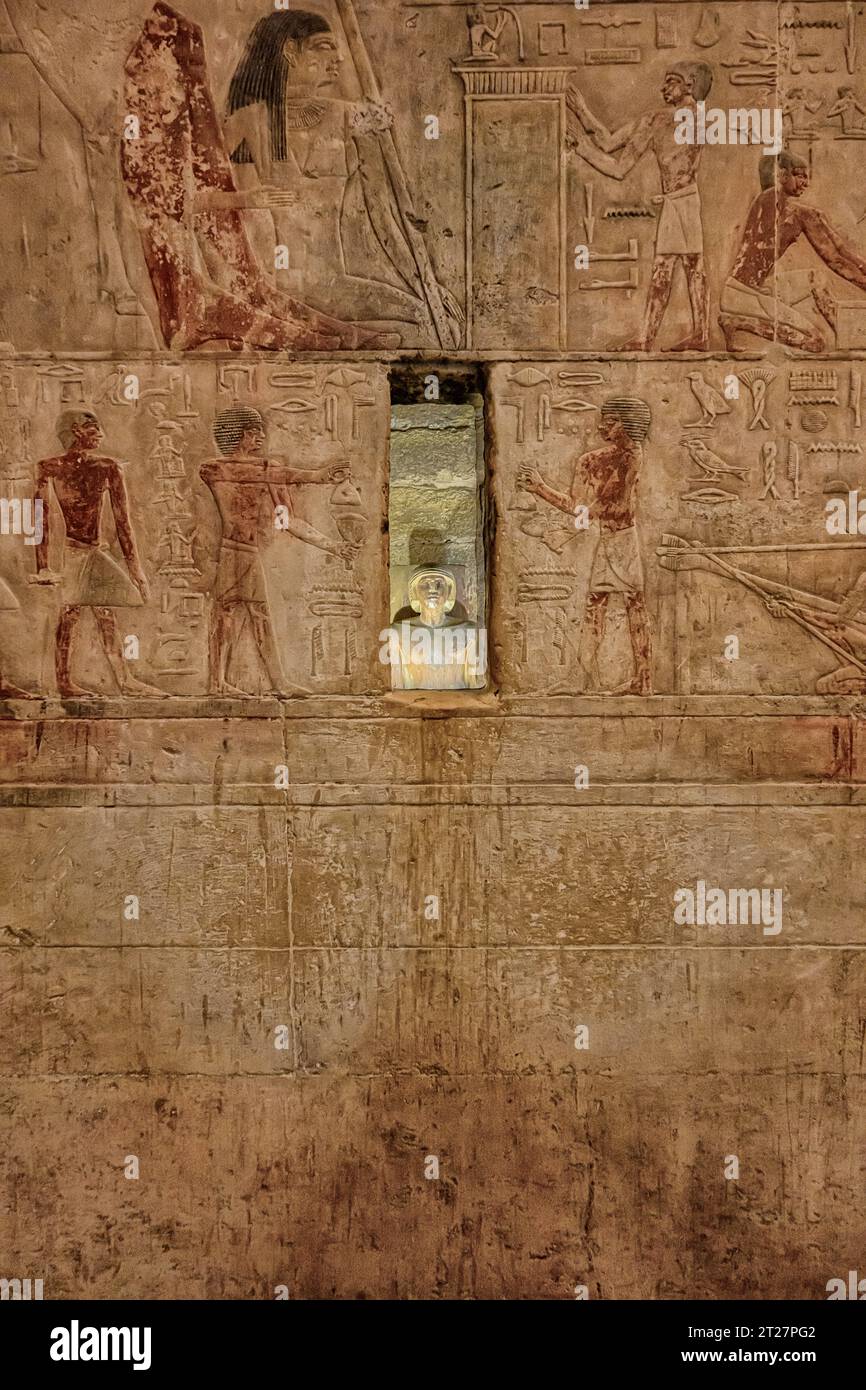 Statue of Ti is visible through an opening in the wall of the Serdab ...