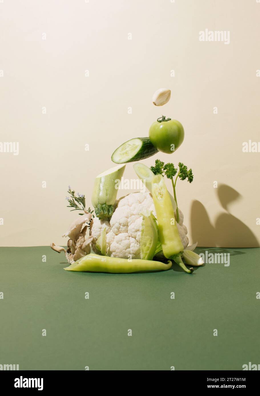 Creative still life of healthy organic food in shades of green color ...