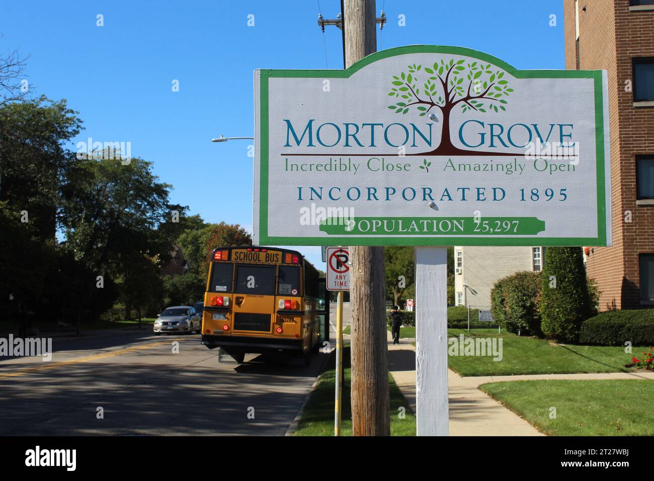 Welcome to Morton Grove sign with a school bus in the background on ...