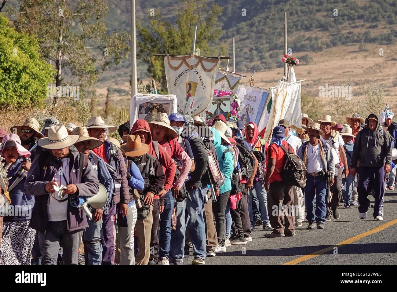 Catholic pilgrims walk down the road on their way to San Juan de Los ...