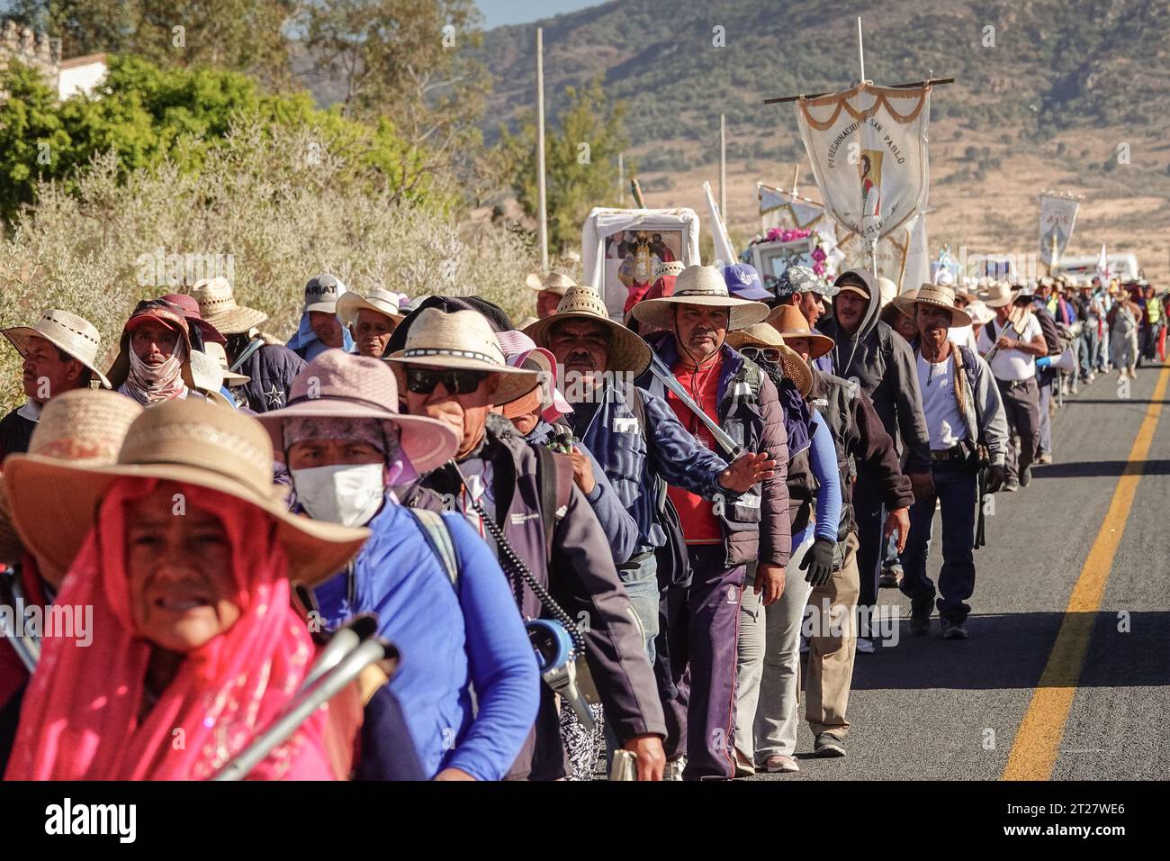 Catholic pilgrims walk down the road on their way to San Juan de Los ...