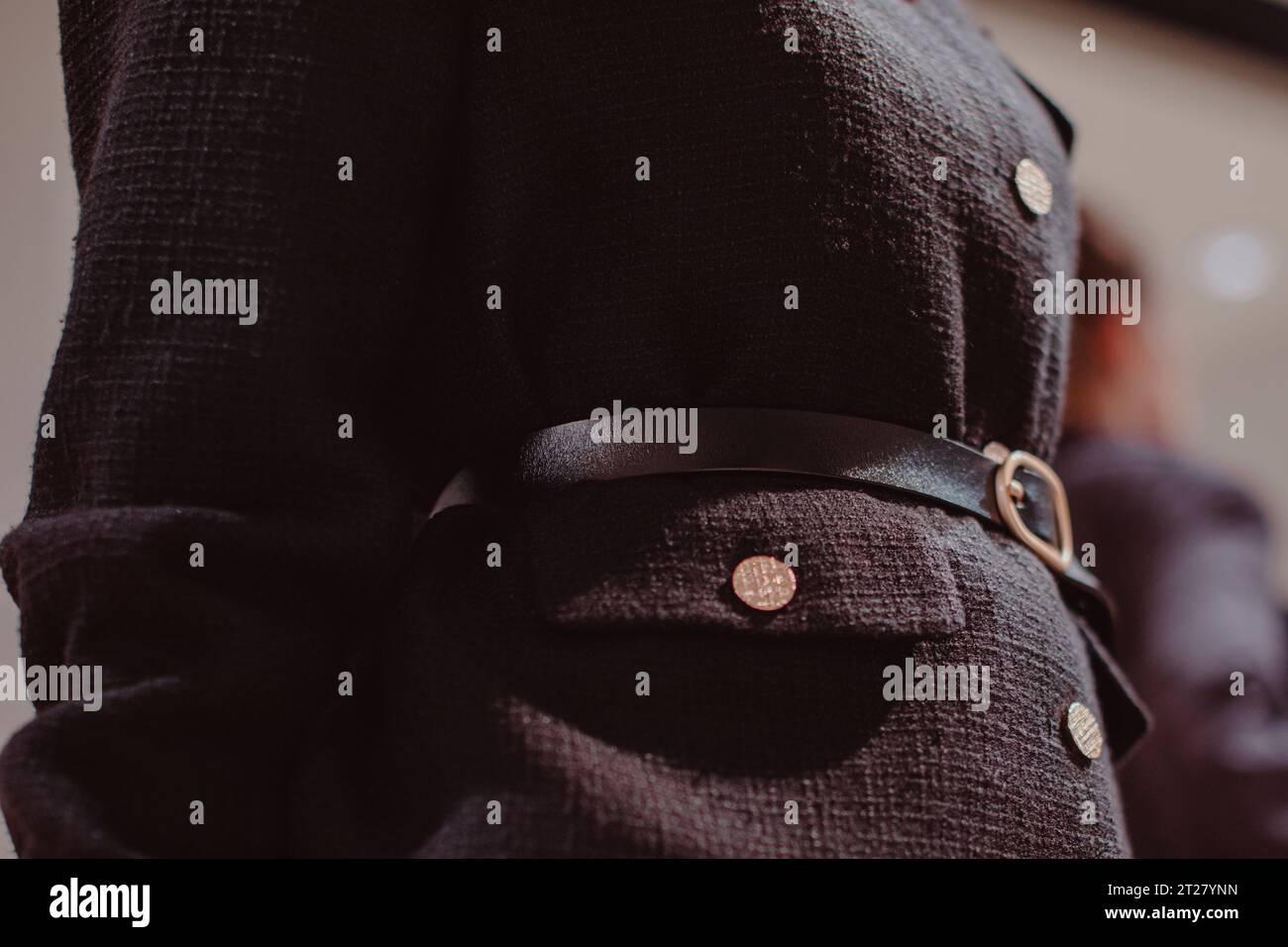 Classy black jacket, leather belt and golden buttons. Fashion details ...