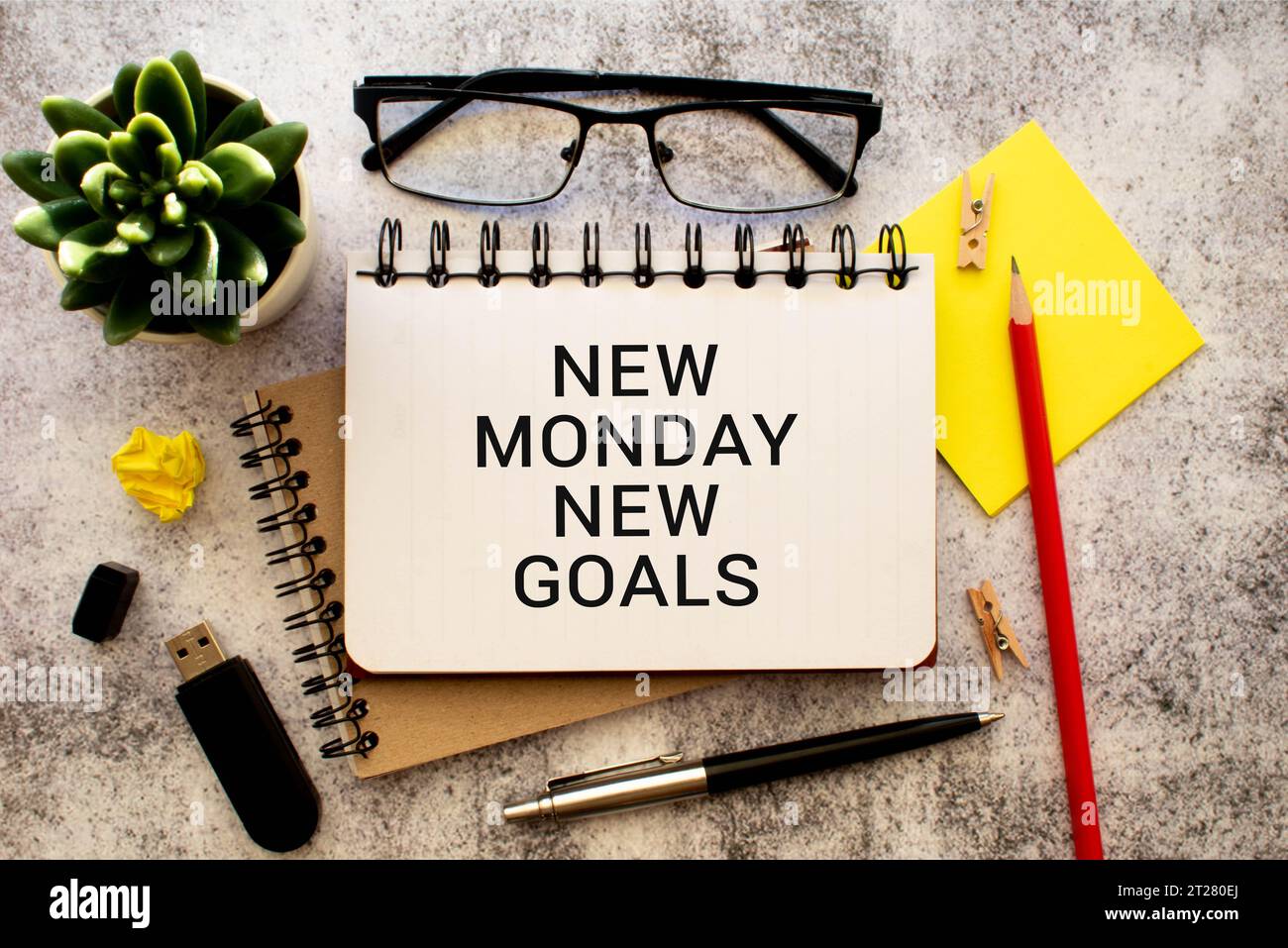 New monday, new goals text concept. Spiral notebook textbook, wooden ...