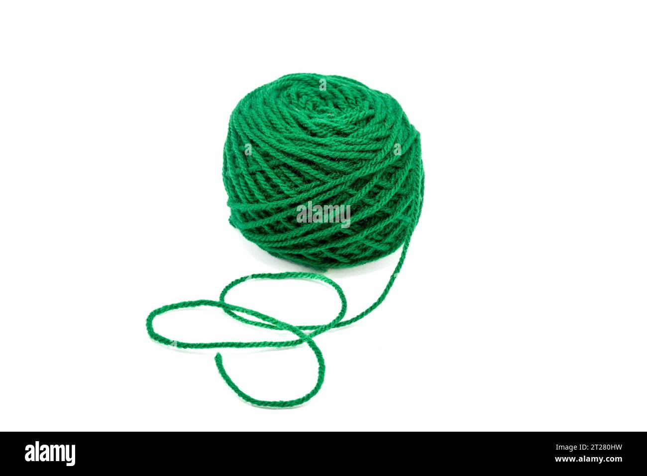 Beautiful bright green wool on a light background Stock Photo - Alamy