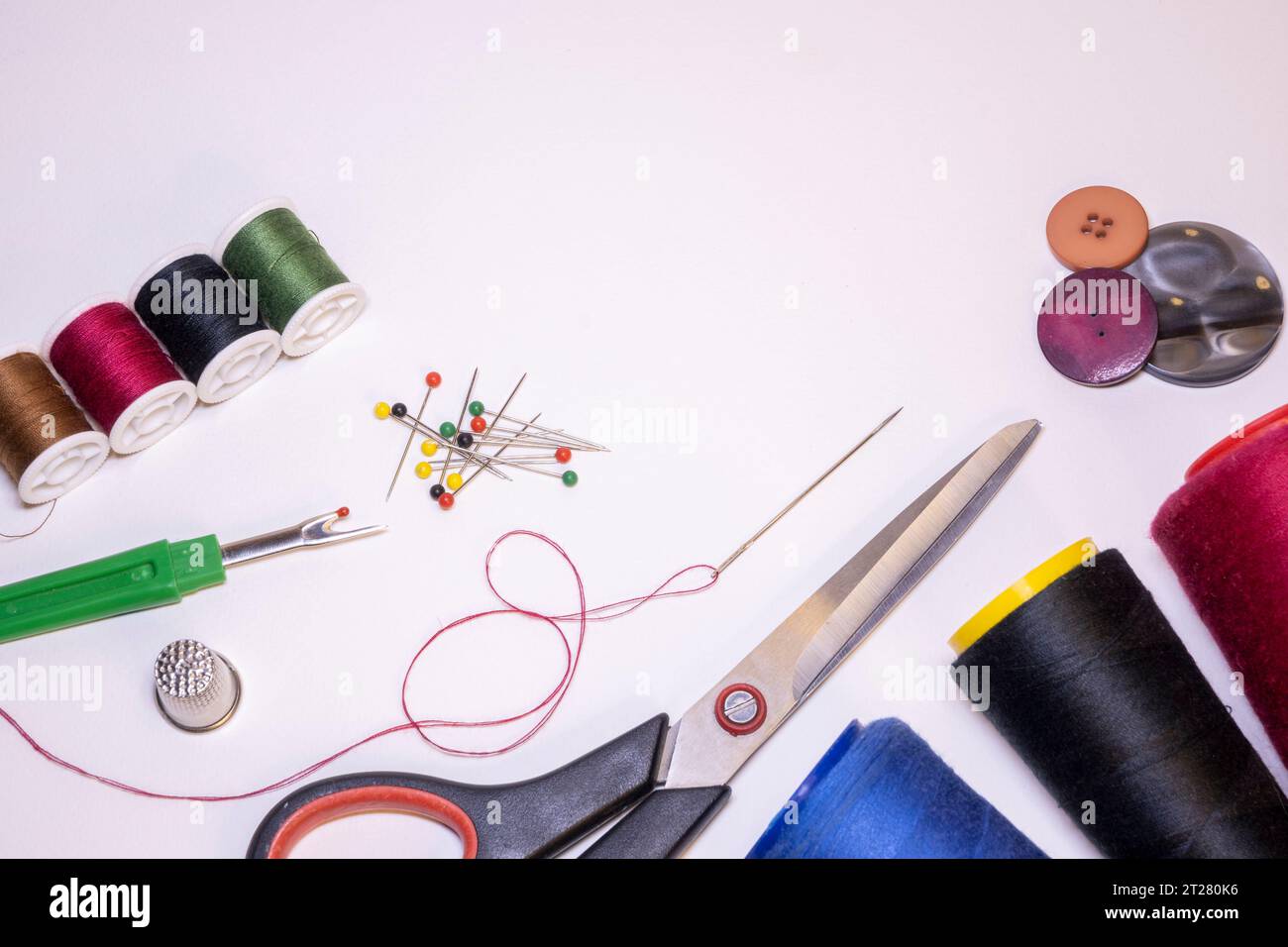Sewing tools on a light background Stock Photo - Alamy