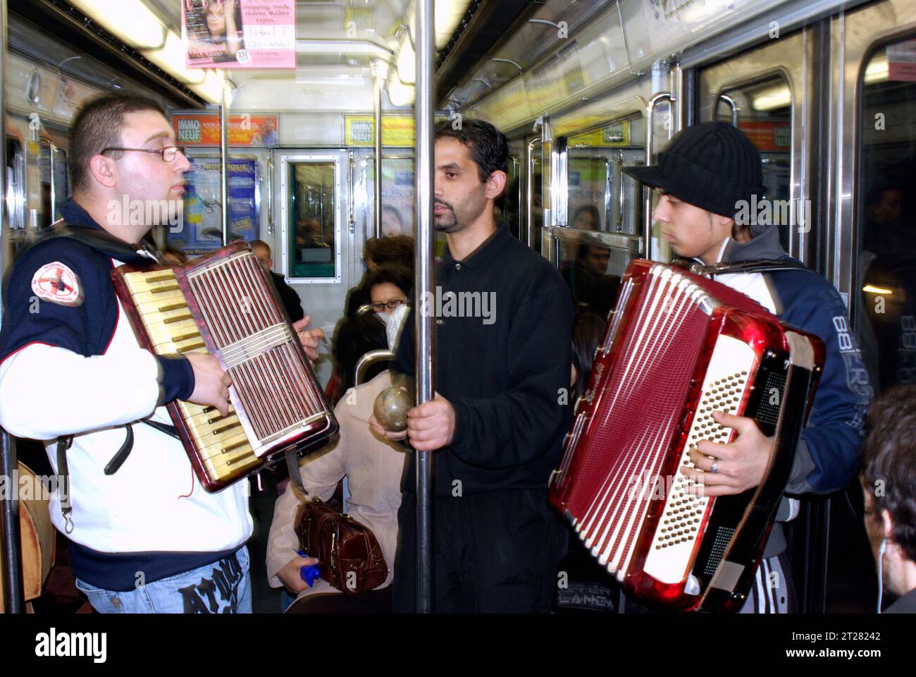 Male musicians busking in a tube train in the Paris underground Stock ...