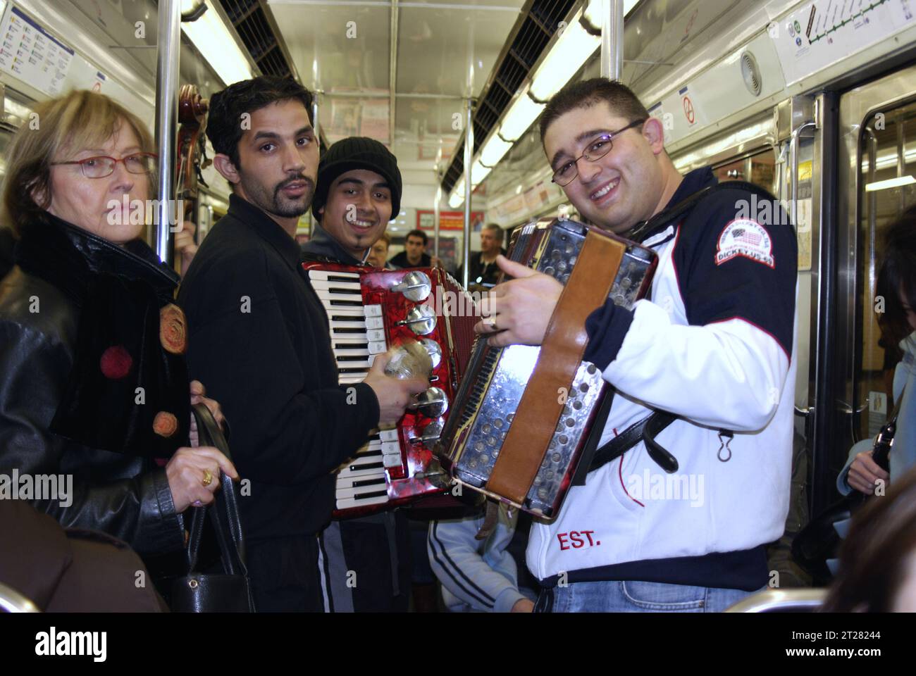 Male musicians busking in a tube train in the Paris underground Stock Photo - Alamy