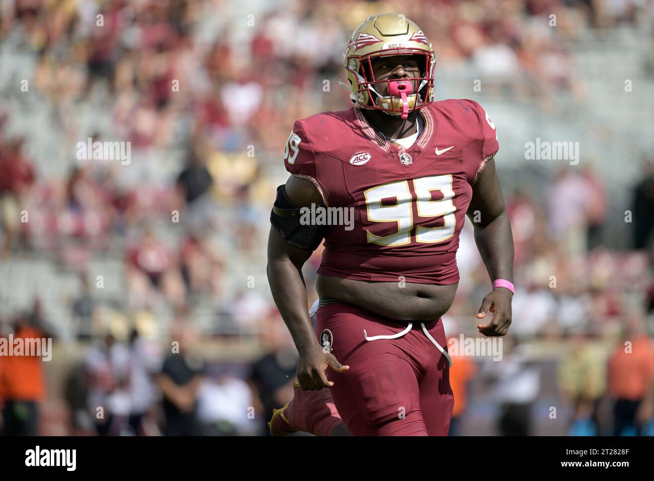 Florida State defensive lineman Malcolm Ray (99) jogs to the sideline ...