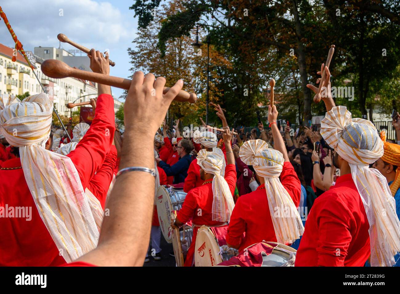 A vibrant procession of people carrying drums and symbols of Lord ...