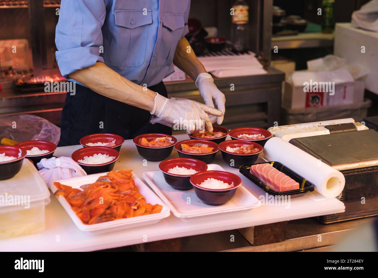 picture of an unrecognizable chef at a street kitchen in the fish ...